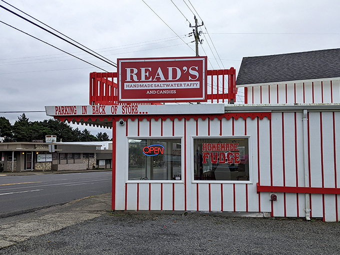 The candy-striped wonderland of Read's Homemade Candies stands like a sweet mirage on Highway 101, promising sugar-fueled bliss to coastal travelers.