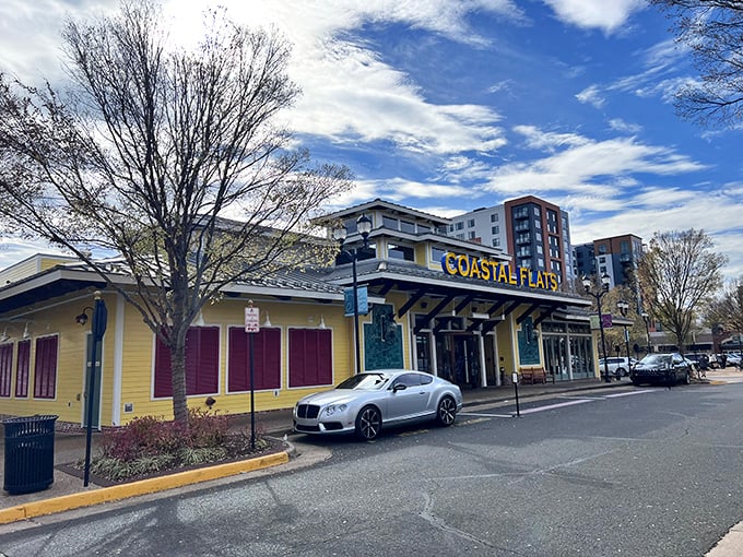 The sunshine-yellow exterior of Coastal Flats stands out in Fairfax like a beach house that took a wrong turn at Virginia Beach and decided to stay.