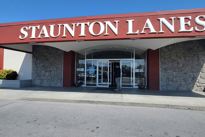 That iconic red sign against the Virginia sky is like a beacon calling all pin-seekers home. Staunton Lanes stands ready for your next strike.