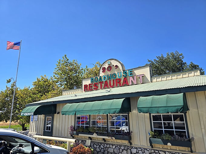 The classic roadside charm of 50's Road House beckons with its vibrant signage and green awnings&mdash;a time portal disguised as a restaurant in Knights Ferry.
