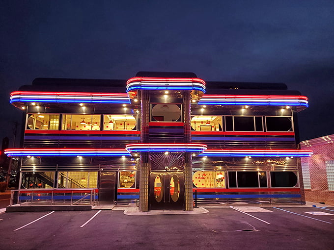 The neon-lit exterior of Goobers Diner glows like a beacon of nostalgia against the night sky, promising comfort food and a trip back in time.