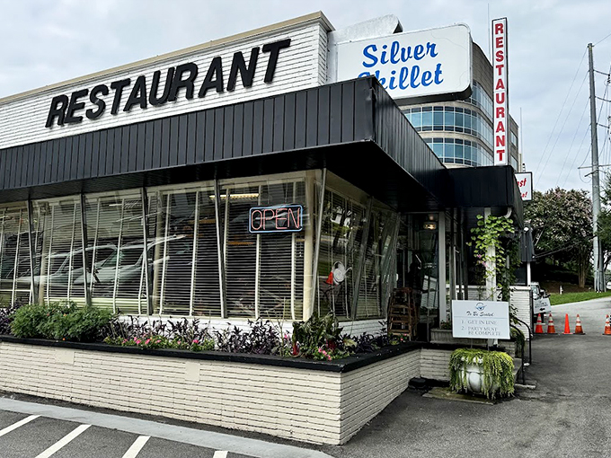 The iconic white brick exterior of Silver Skillet stands like a time capsule in Midtown Atlanta, promising comfort food that transcends trends.