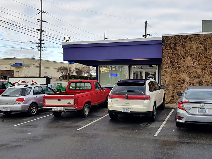 The purple exterior might surprise you, but that neon "OPEN" sign speaks a universal language that translates to "good food inside." 