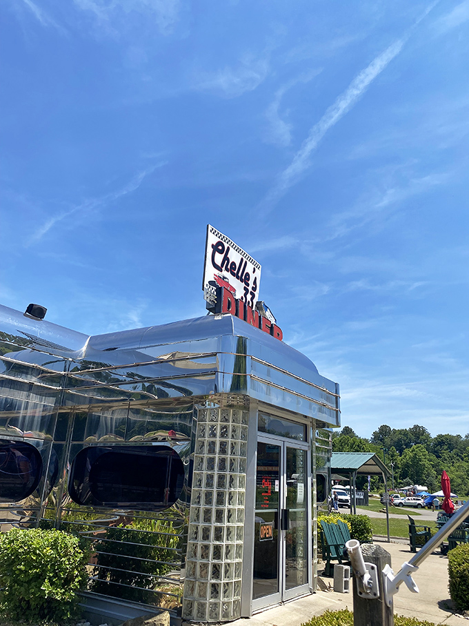 The gleaming stainless steel exterior of Chelle's 33 Diner stands like a time portal to the 1950s, complete with that iconic "33" beckoning hungry travelers.