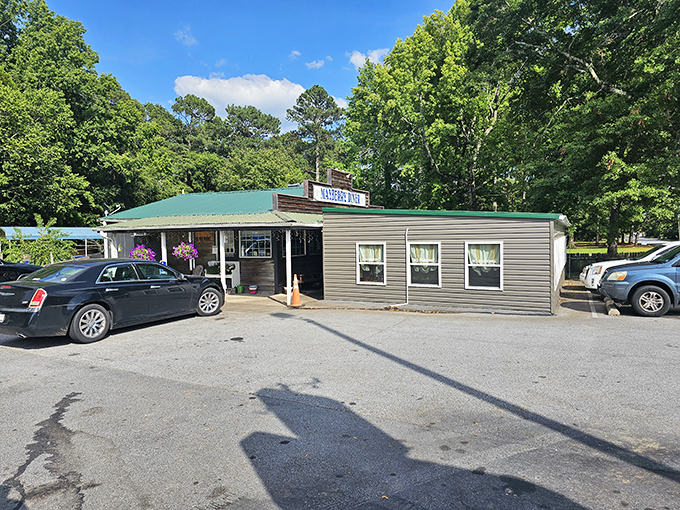 The unassuming exterior of Mayberry Diner stands like a culinary time capsule among the trees, promising honest food without pretense.