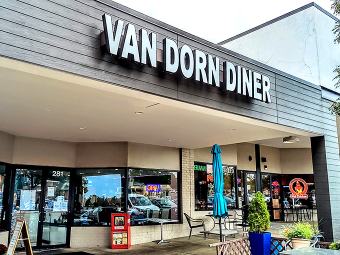 The retro signage beckons like a time machine with a lunch special. Van Dorn Diner's exterior promises a journey back to when calories didn't count and jukeboxes ruled.