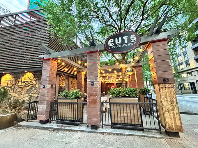 The unassuming exterior of Cuts Steakhouse belies the culinary magic happening inside. Like finding a diamond in downtown Atlanta's concrete jungle.