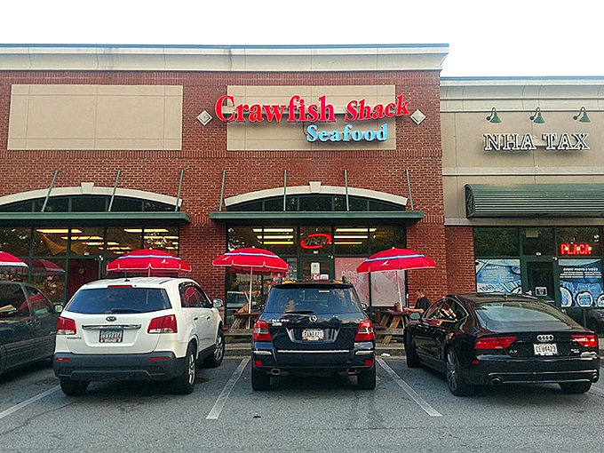 The red neon sign beckons like a lighthouse for seafood lovers. Strip mall location, zero pretension&mdash;just the promise of oceanic treasures within.