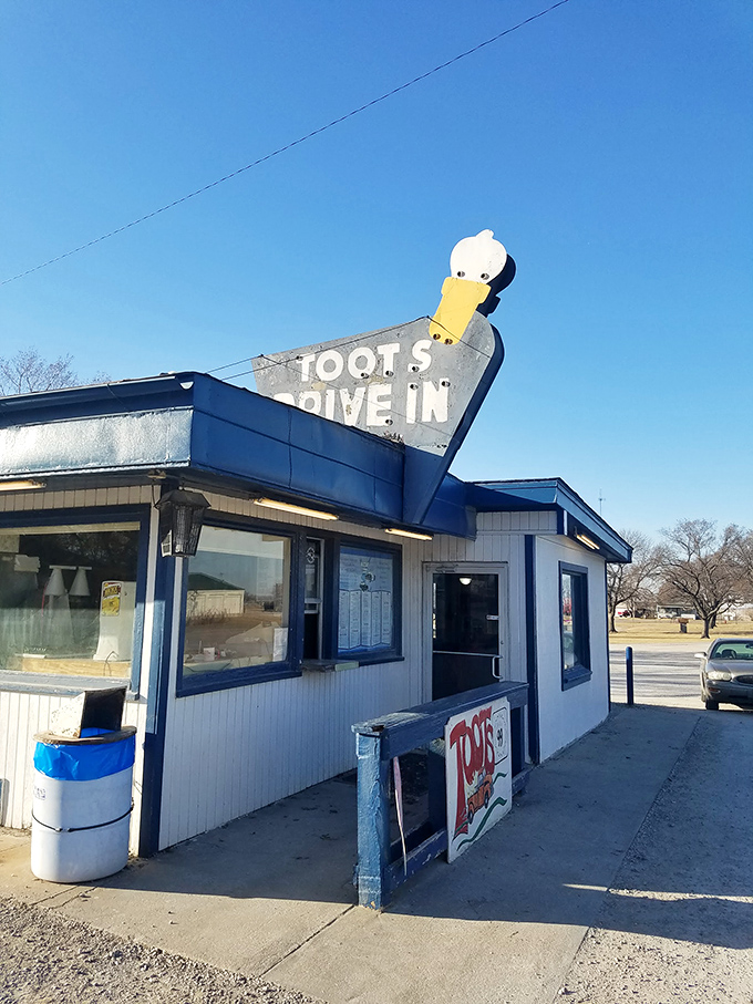 The iconic blue duck sign at Toots Drive-In has been guiding hungry travelers to burger bliss in Howard, Kansas for generations.