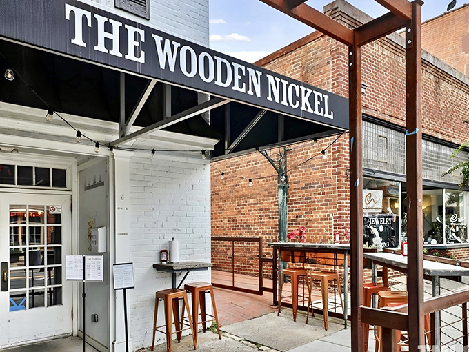 The Wooden Nickel's classic white facade stands proudly on Hillsborough's King Street, beckoning hungry travelers with the promise of comfort and conversation.