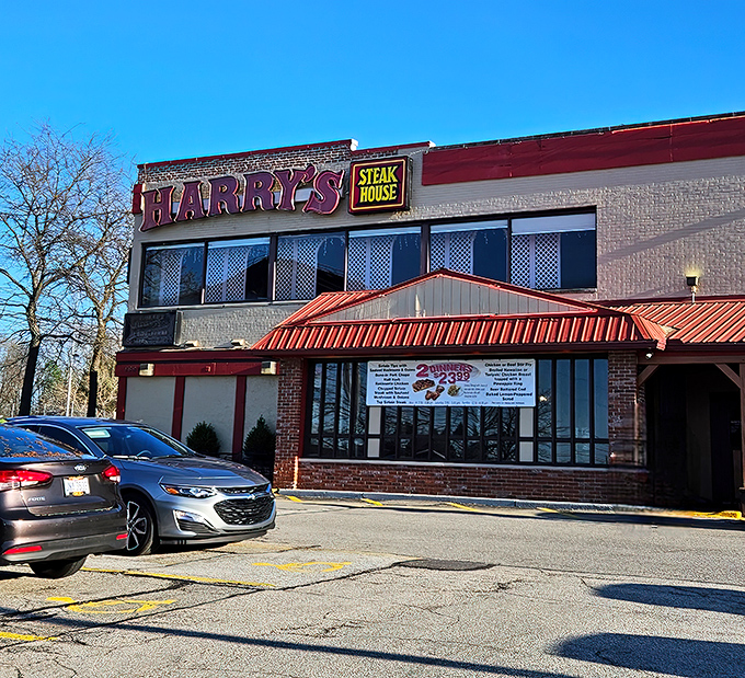 Harry's bold red signage stands like a beacon for hungry travelers, promising steak salvation in an unassuming strip mall setting.