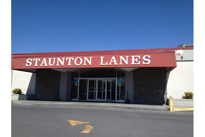 That iconic red sign against the Virginia sky is like a beacon calling all pin-seekers home. Staunton Lanes stands ready for your next strike.