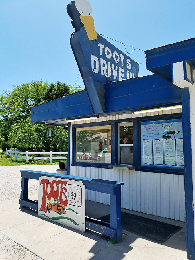 The iconic blue duck sign at Toots Drive-In has been guiding hungry travelers to burger bliss in Howard, Kansas for generations.