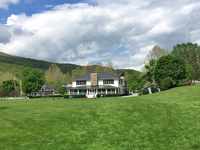 The Swinging Bridge Restaurant stands like a postcard come to life, with autumn-painted mountains creating the perfect backdrop for culinary adventures ahead.