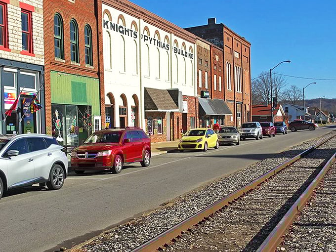 Downtown Spencer's historic storefronts and railroad tracks create that perfect small-town tableau where time seems to slow down just enough to notice life's details.