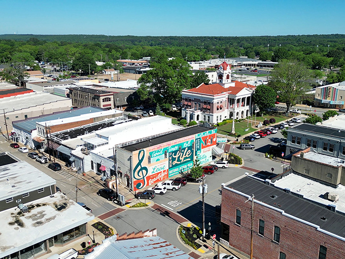 Downtown Searcy unfolds like a storybook from above, with its historic courthouse and colorful music mural creating a Norman Rockwell painting come to life.