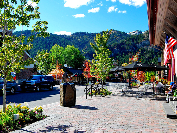Historic brick buildings line Ketchum's charming streets, where spring blossoms frame architecture that whispers stories of Idaho's mining past.