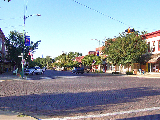 Downtown Lindsborg greets visitors with classic brick buildings, Swedish flags, and that small-town charm that makes you want to cancel your return flight.