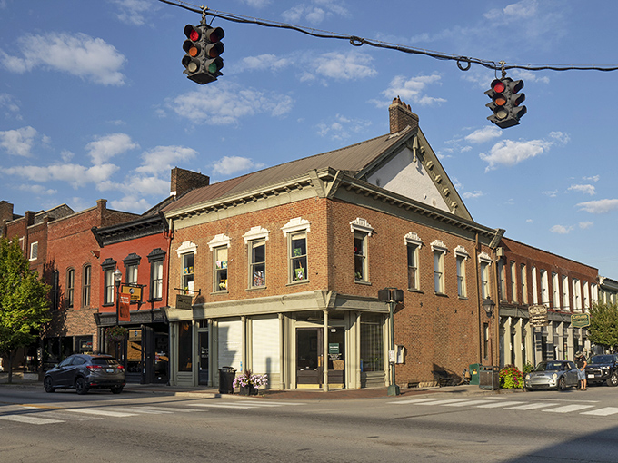 Bardstown's courthouse stands like a Victorian sentinel watching over the town square, its brick fa&ccedil;ade glowing warm in the golden hour light.