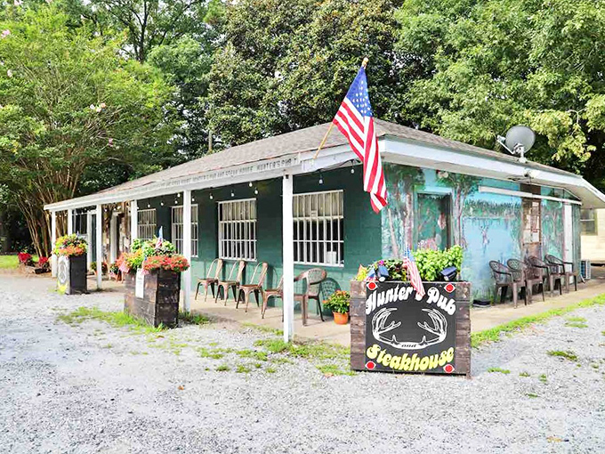The unassuming exterior of Hunters Pub might fool you—but those hanging flower baskets and packed porch are telltale signs of culinary greatness within.
