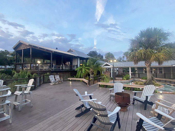 The welcoming pavilion entrance to Skippers Fish Camp beckons like a coastal siren song, promising seafood treasures just beyond those white columns.