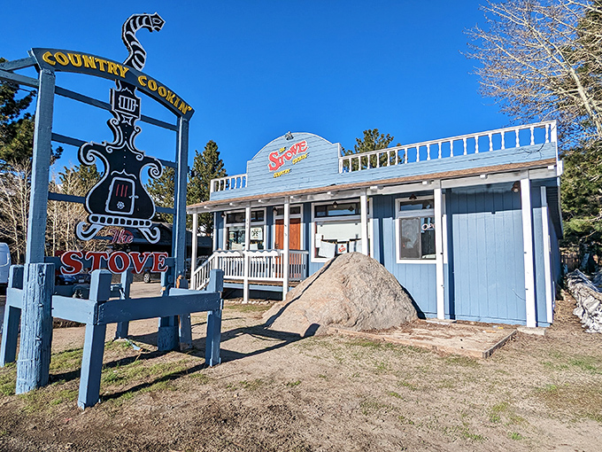 The iconic blue exterior of The Stove with its vintage sign promising "Country Cookin'" stands like a beacon for breakfast pilgrims in Mammoth Lakes.