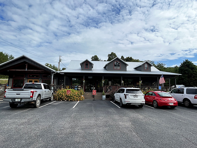 The log cabin exterior of The Sawmill Place stands proudly against blue Georgia skies, promising comfort food that'll make your soul do a happy dance.