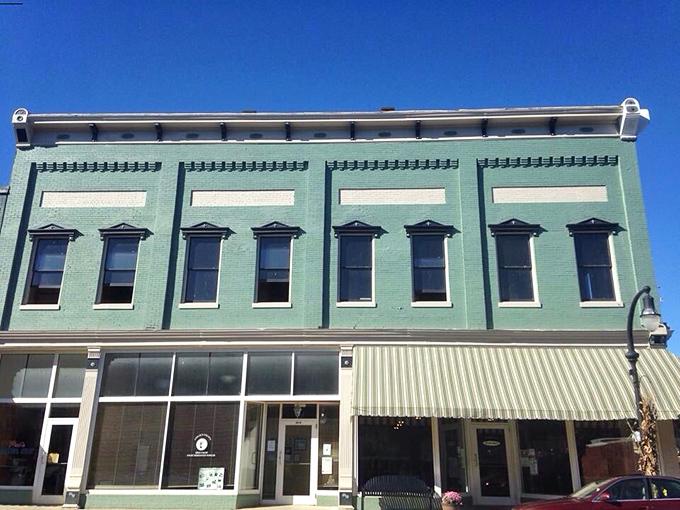 The historic mint-green facade of The Bluebird stands proudly on Stanford's Main Street, a beacon of breakfast bliss waiting to be discovered.
