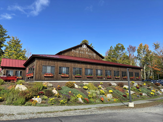 The promised land of pancakes rises from the New Hampshire hillside like a timber cathedral to breakfast perfection. Polly's rustic exterior promises culinary salvation ahead.