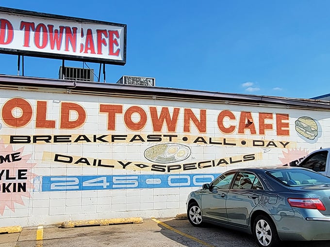 The unassuming exterior of Old Town Cafe stands as a beacon for breakfast lovers, promising "BREAKFAST ALL DAY" like a mantra for the hungry masses. 