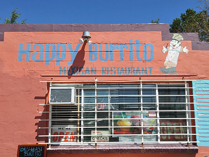 The pink adobe exterior of Happy Burrito stands out like a desert mirage, complete with vintage Studebaker that's as classic as their recipes.