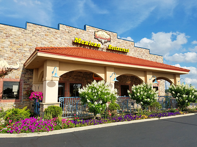 El Rodeo East's stone facade and terracotta roof stand like a delicious mirage in Richmond, promising authentic flavors behind those welcoming arches.