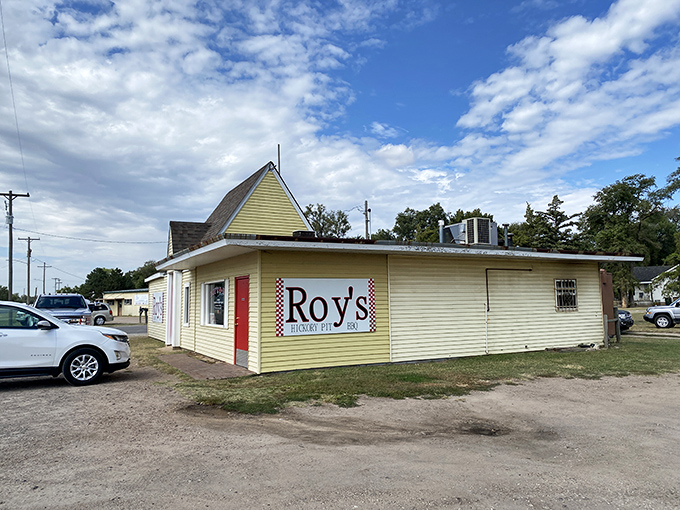 The unassuming yellow building with its bright red door stands like a beacon of barbecue hope on Hutchinson's West 4th Avenue.