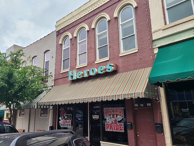 Heroes Restaurant & Pub stands like a culinary sentinel on Pine Street, its historic brick facade and turquoise sign promising comfort and satisfaction within.