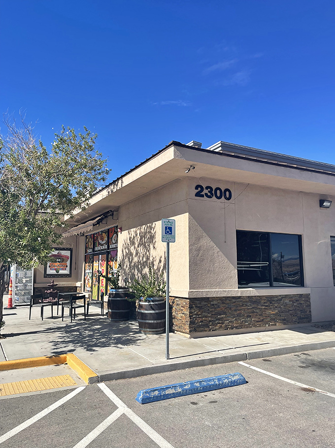 The vibrant facade of Chile Poblano beckons from the roadside in Moapa, a visual menu promising culinary adventures that await inside