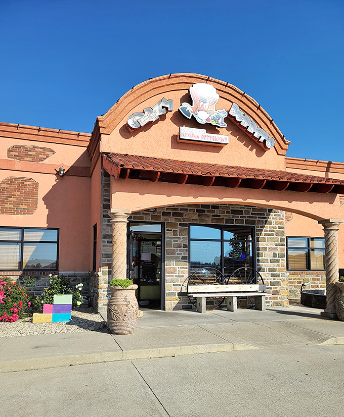 Stone archways and vibrant orange walls create the perfect backdrop for what's about to become your new favorite Mexican escape in Ohio.
