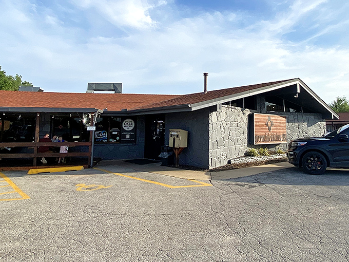The sun-bleached Route 66 sign against stone and wood tells you everything &ndash; authentic southwestern flavors await behind these doors.