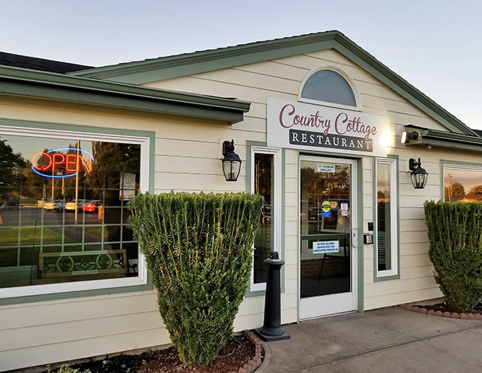 The unassuming yellow exterior of Country Cottage Restaurant stands like a beacon of comfort food hope in Woodburn, promising delicious secrets within.