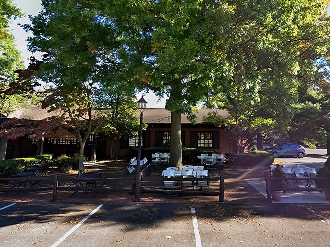 The Wooden Angel's shaded exterior beckons like a culinary oasis in small-town Pennsylvania. Those white-clothed outdoor tables whisper promises of al fresco magic.