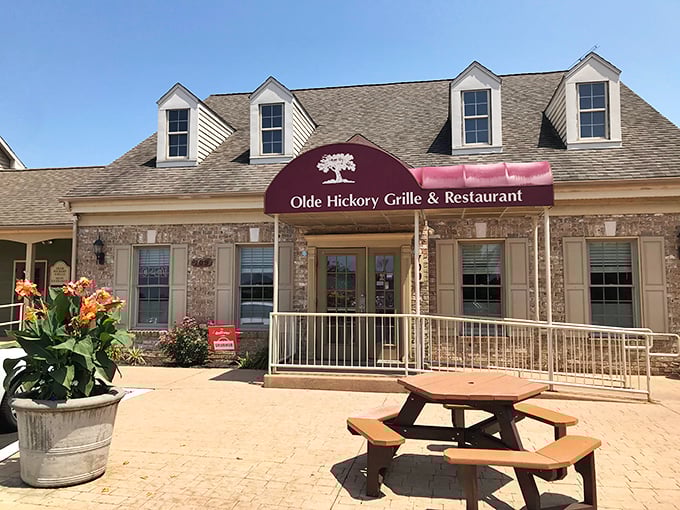 The stone facade and welcoming porch of Olde Hickory Grille promises comfort before you even step inside.