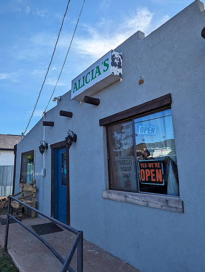 The unassuming exterior of Alicia's might fool you, but that blue door is basically a portal to flavor country. No fancy frills needed.