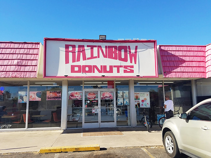 The pink-roofed sanctuary of sweetness beckons from McDowell Road, promising sugary salvation to early risers and donut devotees alike.