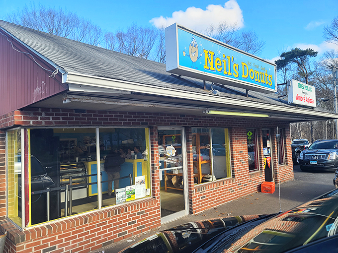 The unassuming brick exterior of Neil's Donuts hides a world of sugary wonders within. Connecticut's donut pilgrimage begins here.