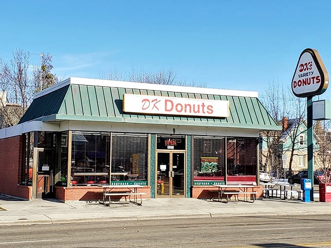 The green-roofed temple of fried dough stands like a beacon on State Street, promising sweet salvation to all who enter.
