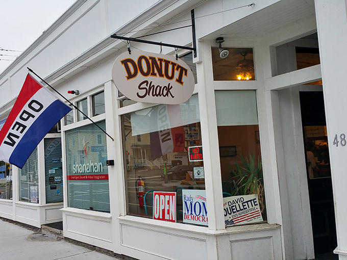 The classic barber pole and vintage sign beckon like an old friend. This modest storefront in Lowell hides donut treasures better than any fancy bakery could dream of.