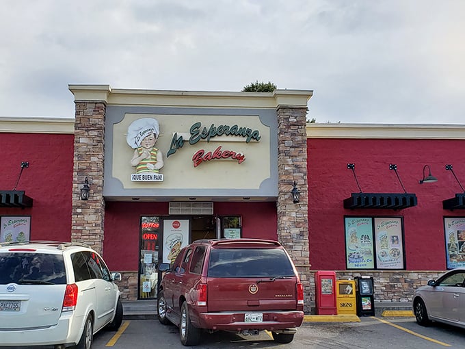 The vibrant pink exterior of La Esperanza Bakery stands out like a delicious dessert itself, beckoning hungry travelers with promises of authentic Mexican treats.