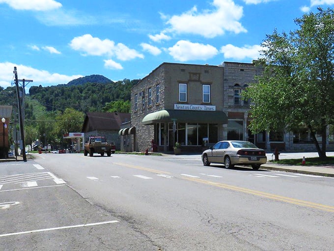 The Jasper Getaway sign welcomes visitors with a splash of orange against the Ozark backdrop &ndash; small-town charm with big-time views awaits.