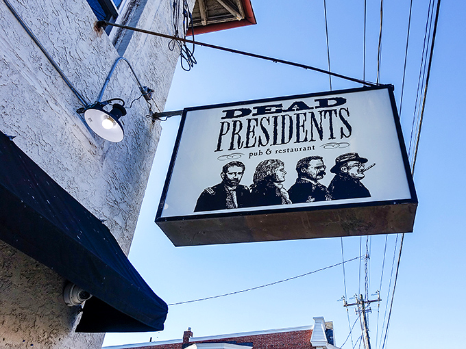 The iconic Dead Presidents sign welcomes patrons with silhouettes of Lincoln, Jefferson, Roosevelt, and Washington &ndash; history class never looked this appetizing.