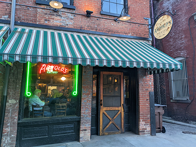 The unassuming exterior of Arnold's Bar & Grill beckons with its vintage charm and green-striped awning&mdash;Cincinnati's worst-kept secret hiding in plain sight.