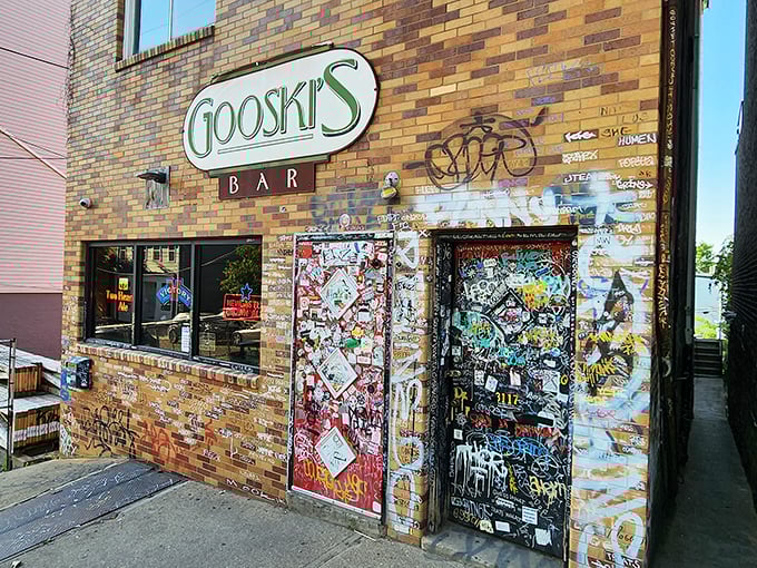 The iconic brick fa&ccedil;ade of Gooski's looks like the gatekeeper of Pittsburgh's underground music scene, complete with generations of sticker graffiti chronicling its storied history.